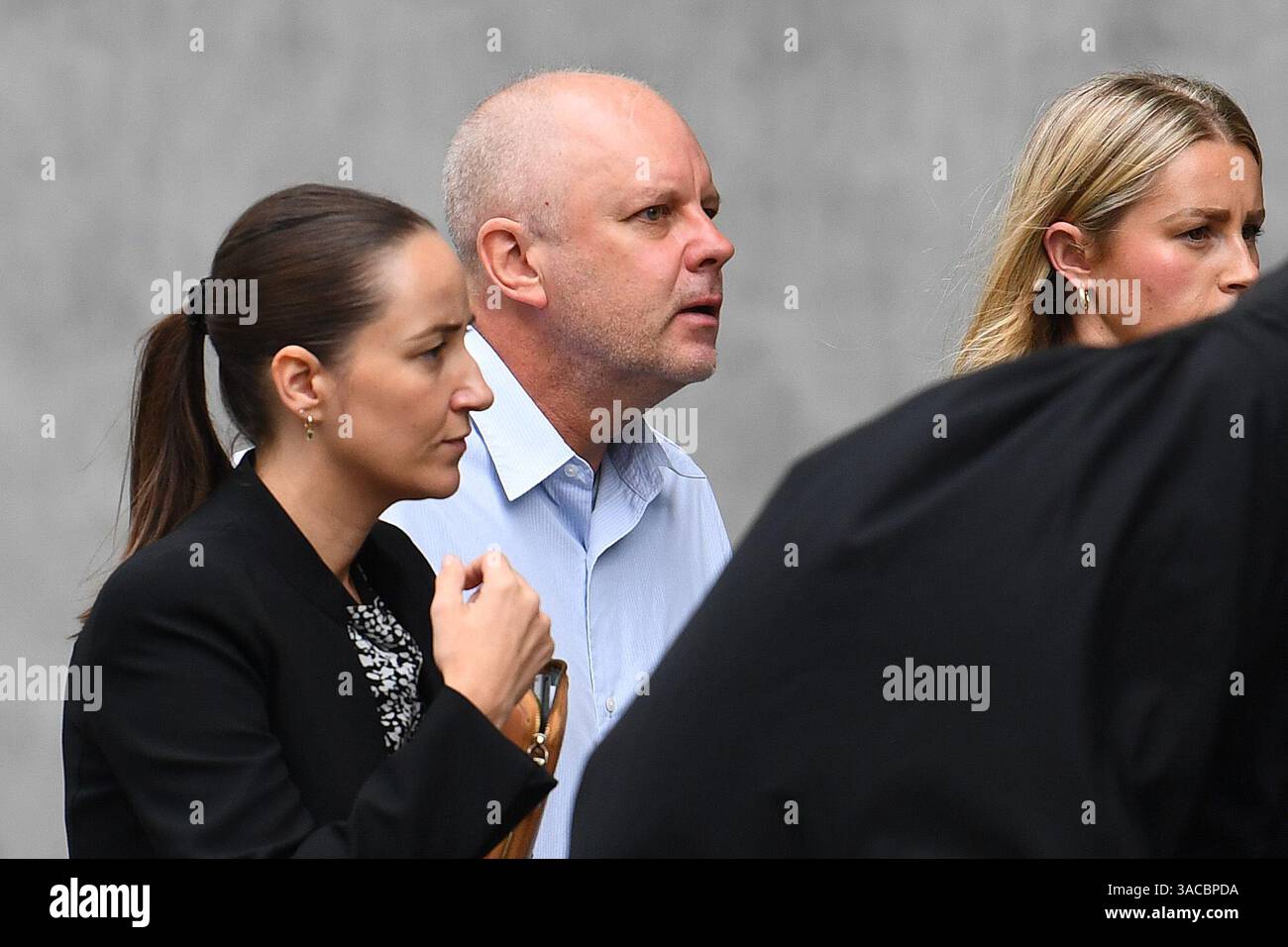 John Robert Ullman (middle) arrives to Brisbane Supreme Court in ...