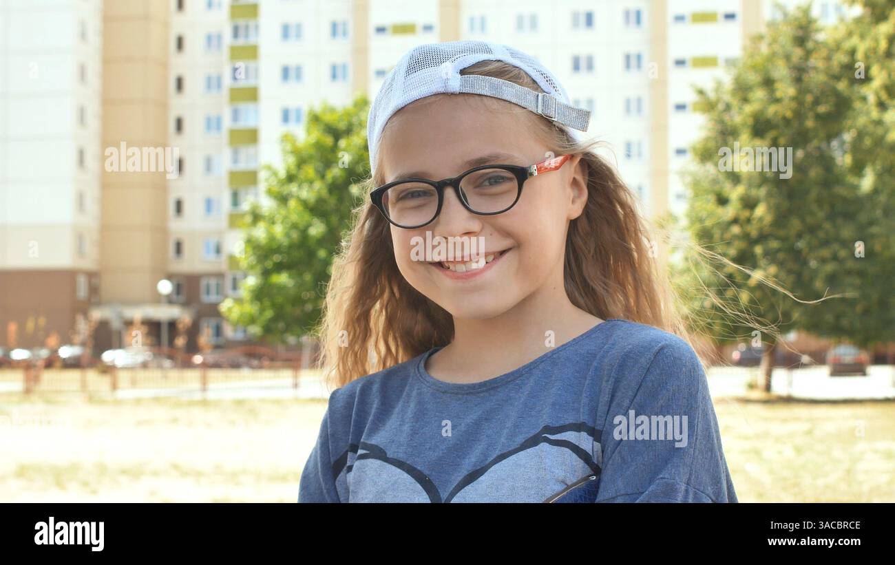 Cheerful schoolgirl glasses cap hi-res stock photography and images - Alamy