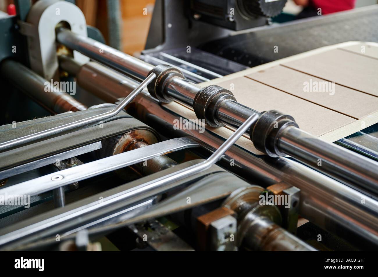 Innovative machine efficiently folds cardboard box flaps for ...