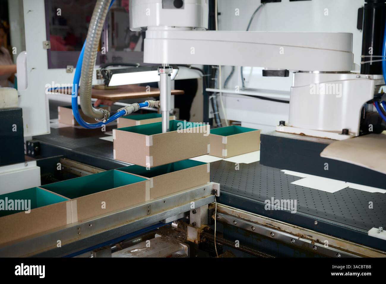 Innovative robot technology streamlines the gluing process of cardboard ...