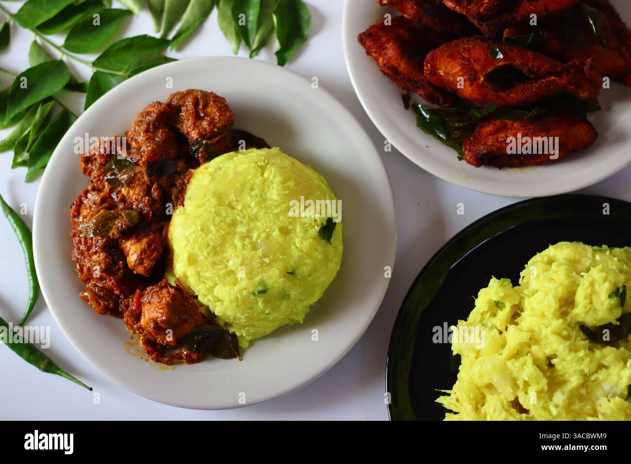 Boiled and mashed tapioca served with spicy chicken curry and crispy ...
