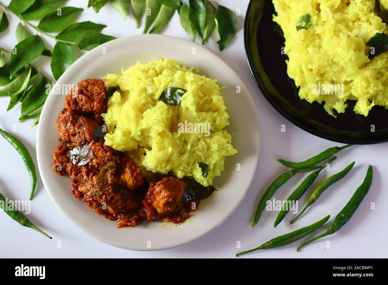 Boiled and mashed tapioca served with rich and spicy chicken curry ...