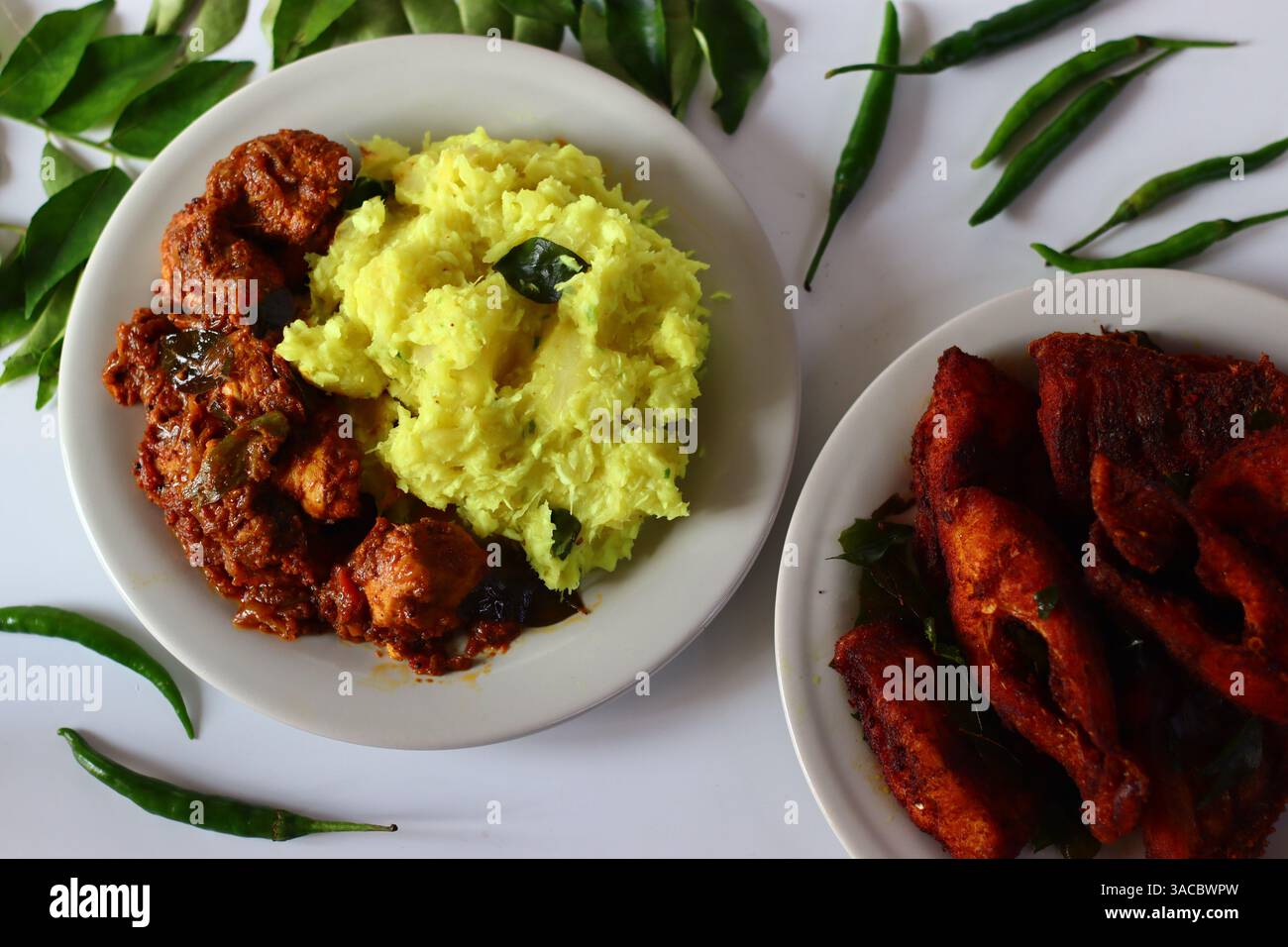 Boiled and mashed tapioca served with spicy chicken curry and crispy ...