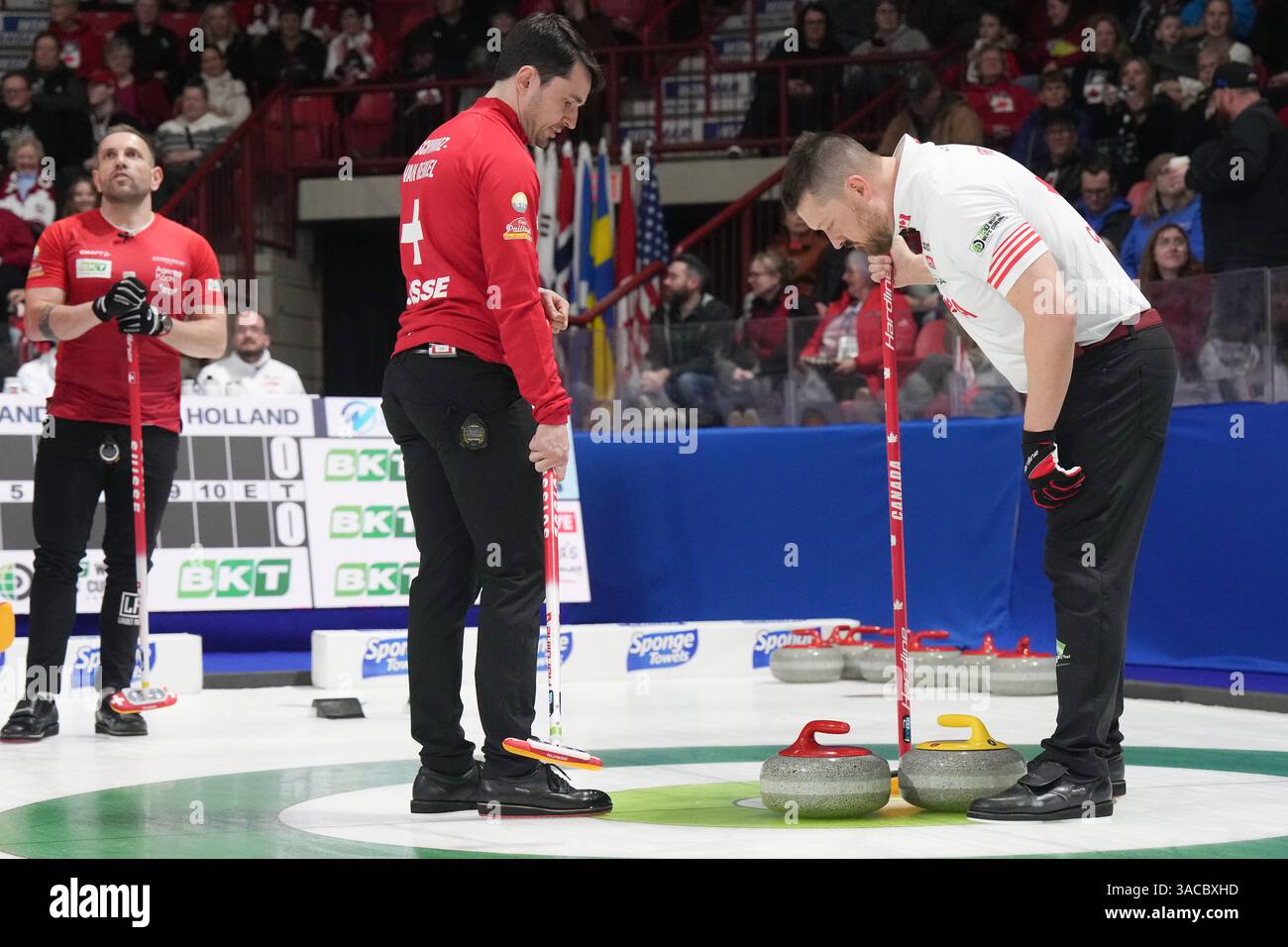 Canada's Ben Hebert and Switzerland skip Benoit Schwarz-van Berkel look ...