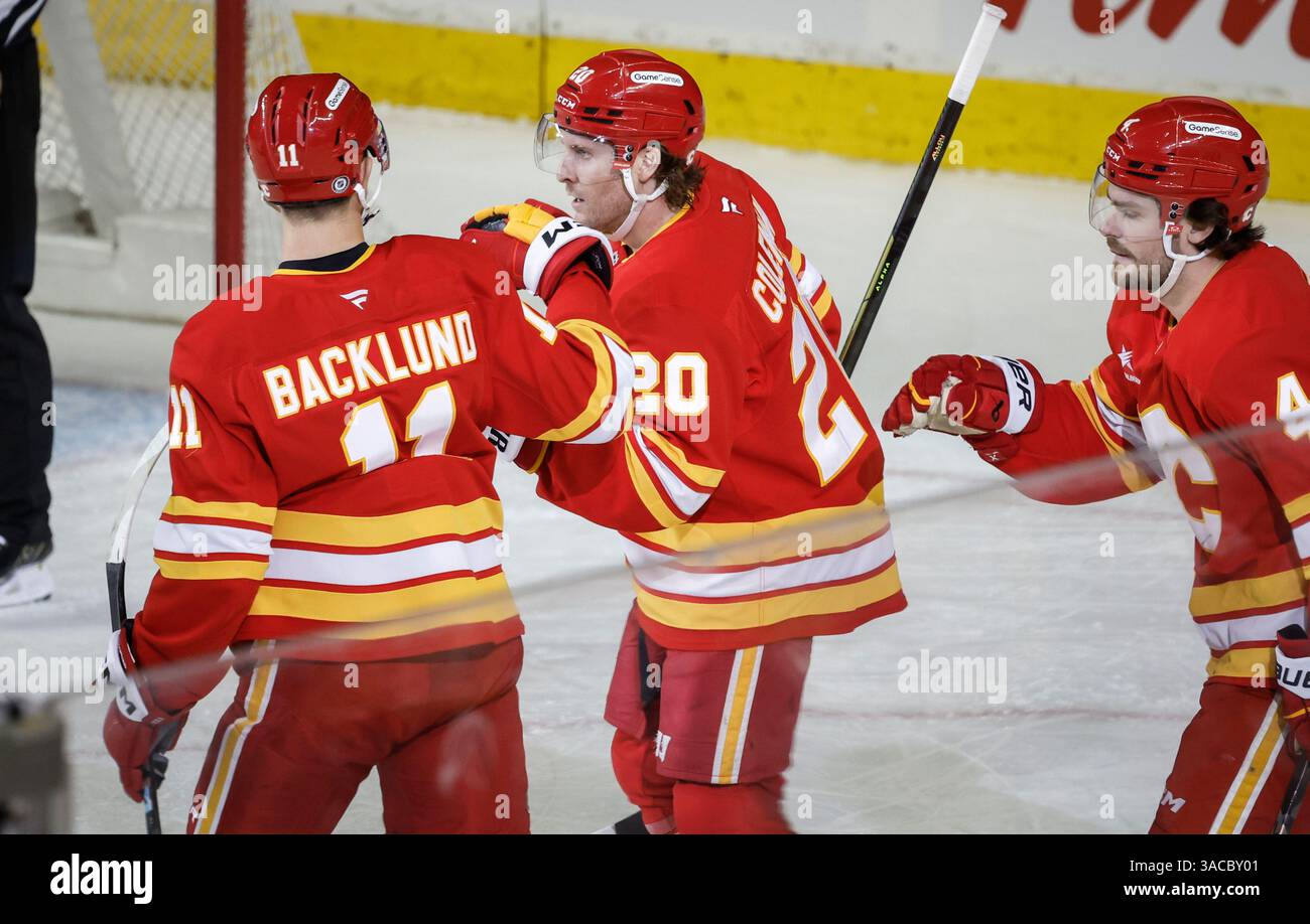 Calgary Flames' Blake Coleman, centre, celebrates his goal with ...