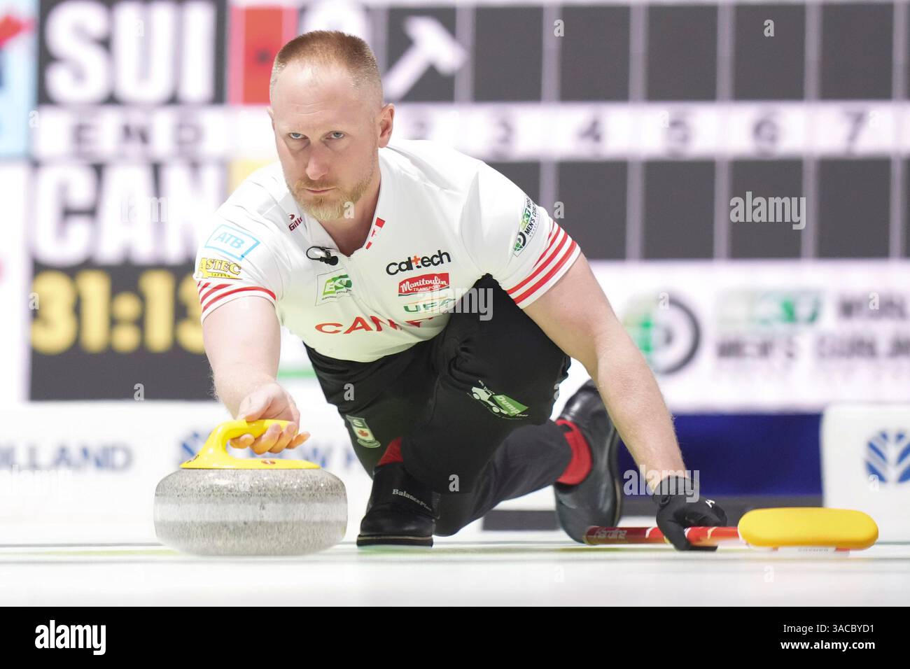 Canada's skip Brad Jacobs throws a stone during his country's match ...