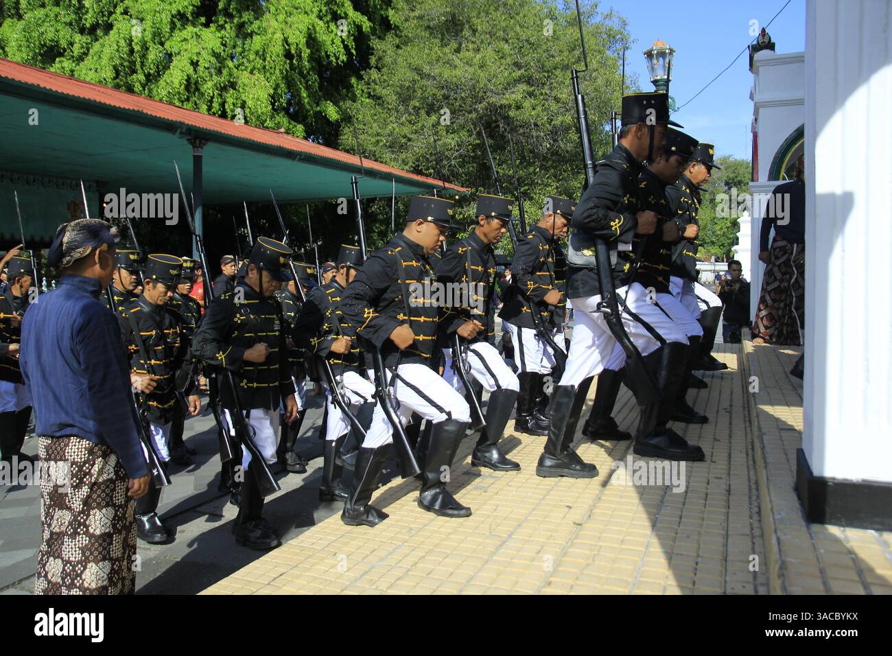 Pura Pakualaman soldiers armed with gun line up neatly while taking ...