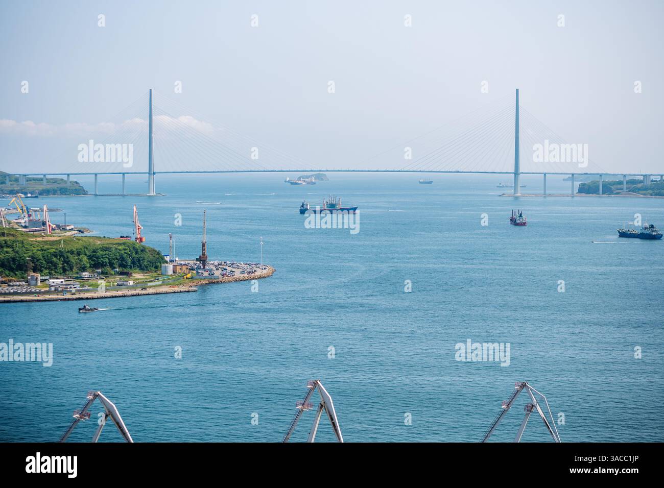 Cargo ships navigating eastern bosphorus strait under russky bridge ...