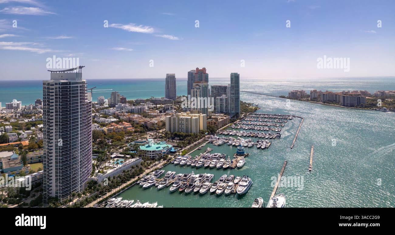 Luxury yacht cruising on Miamis coastline. Aerial view of yachts docked ...