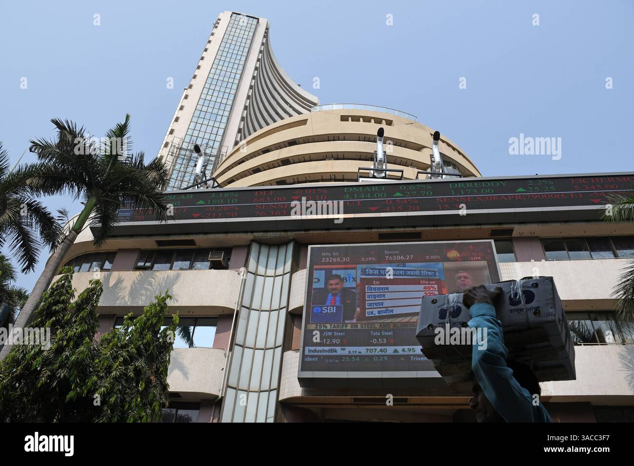 Bombay Stock Exchange BSE in Mumbai, India A fruit seller walks in ...