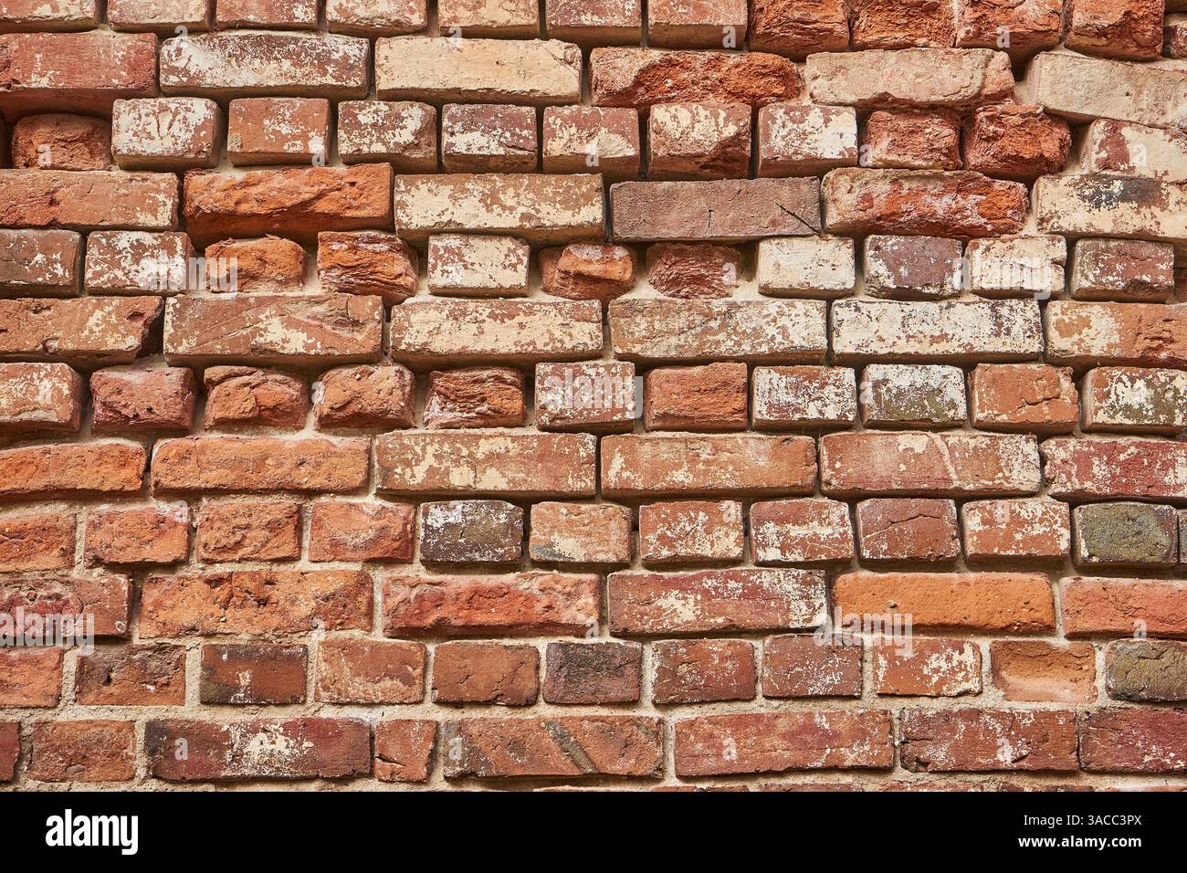 Old red brick wall background, uneven brickwork Stock Photo - Alamy