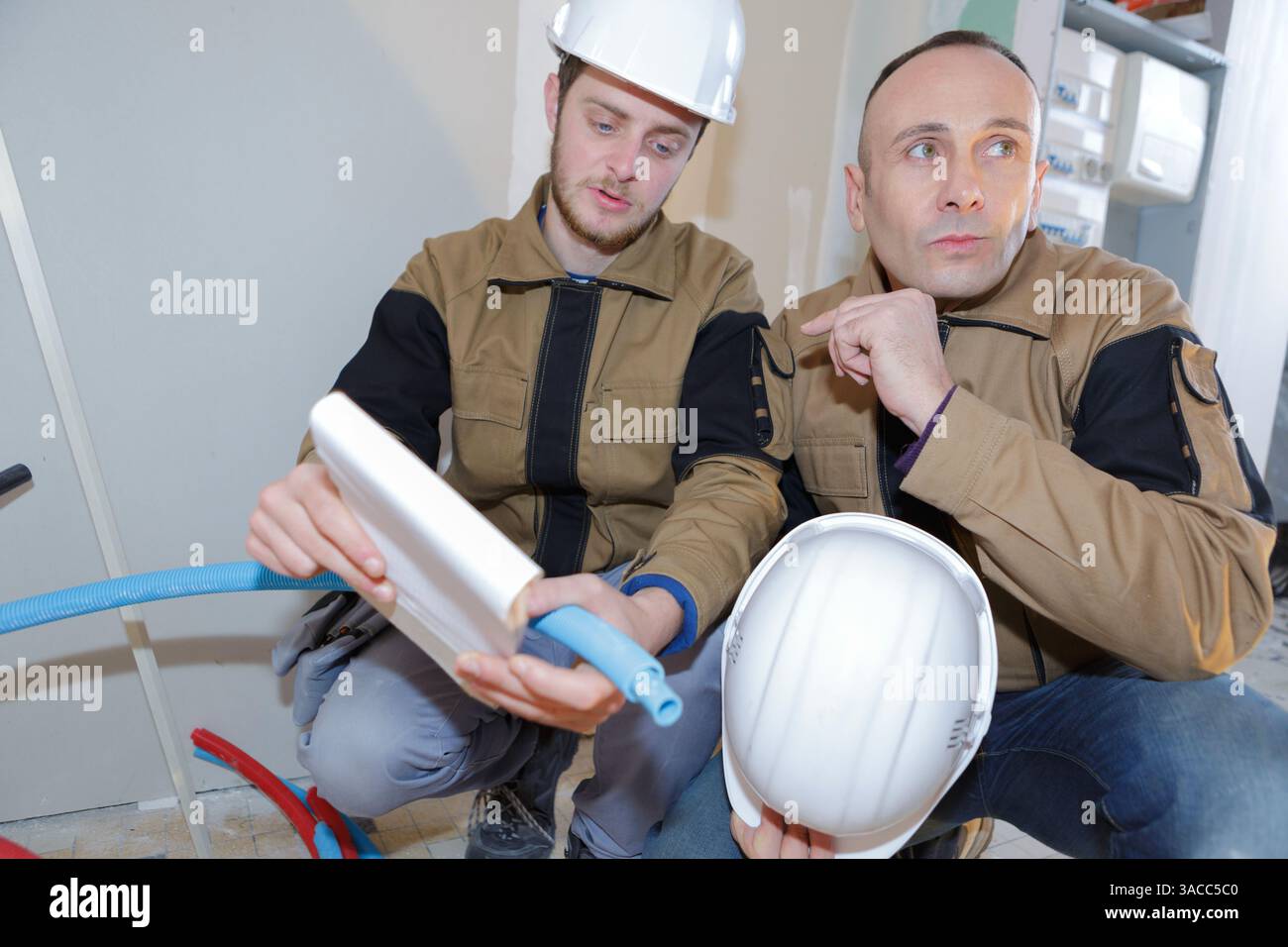 teenager with professional brick layer in training school Stock Photo ...