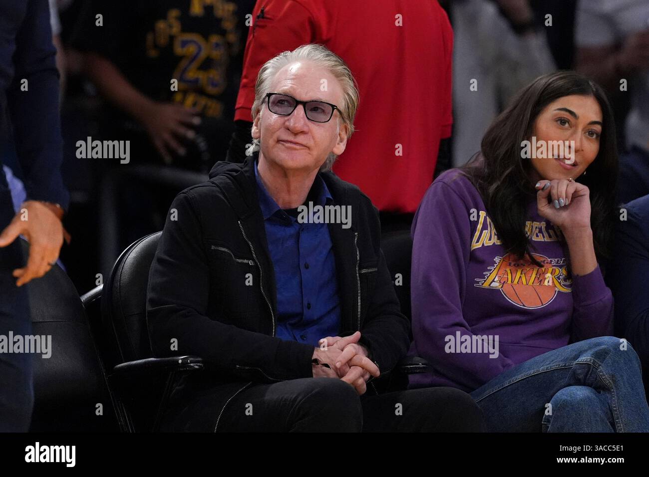 Comedian Bill Maher watches during the first half of an NBA basketball ...