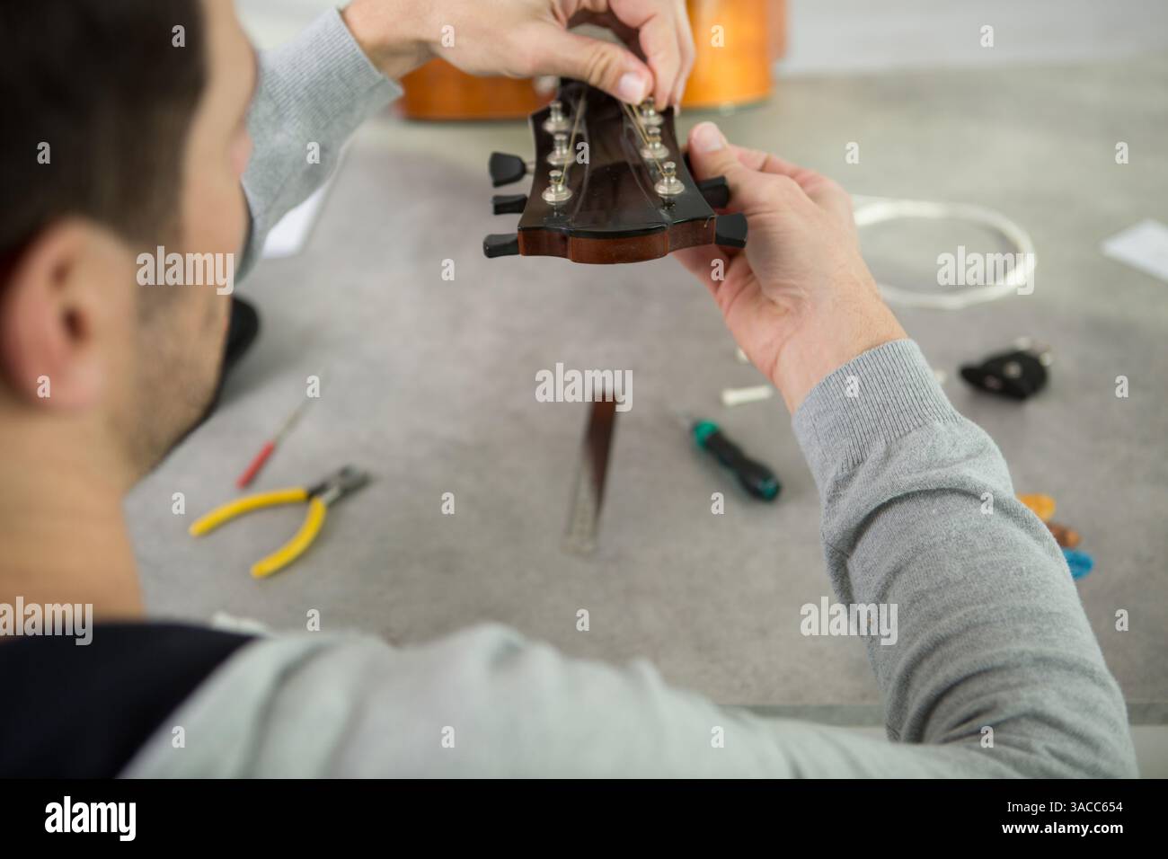 Closeup pair hands fixing hi-res stock photography and images - Alamy