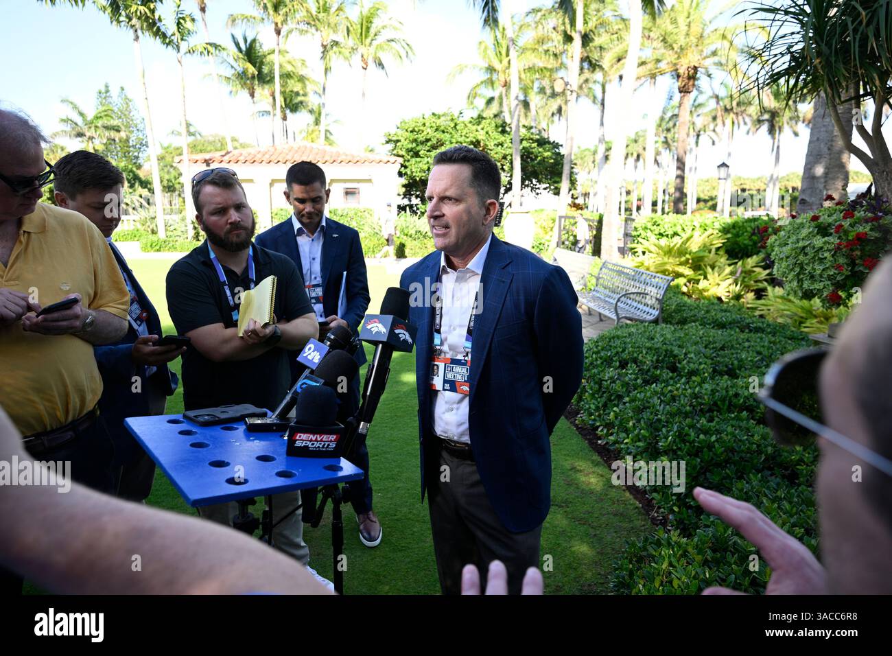 Denver Broncos general manager George Paton, second from right, meets ...