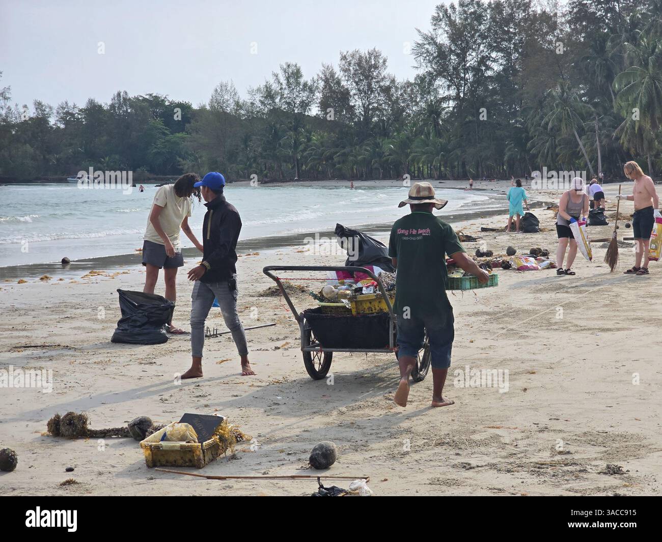 Koh Kood, Thailand, 13 March 2025, Volunteers and locals gather on the ...