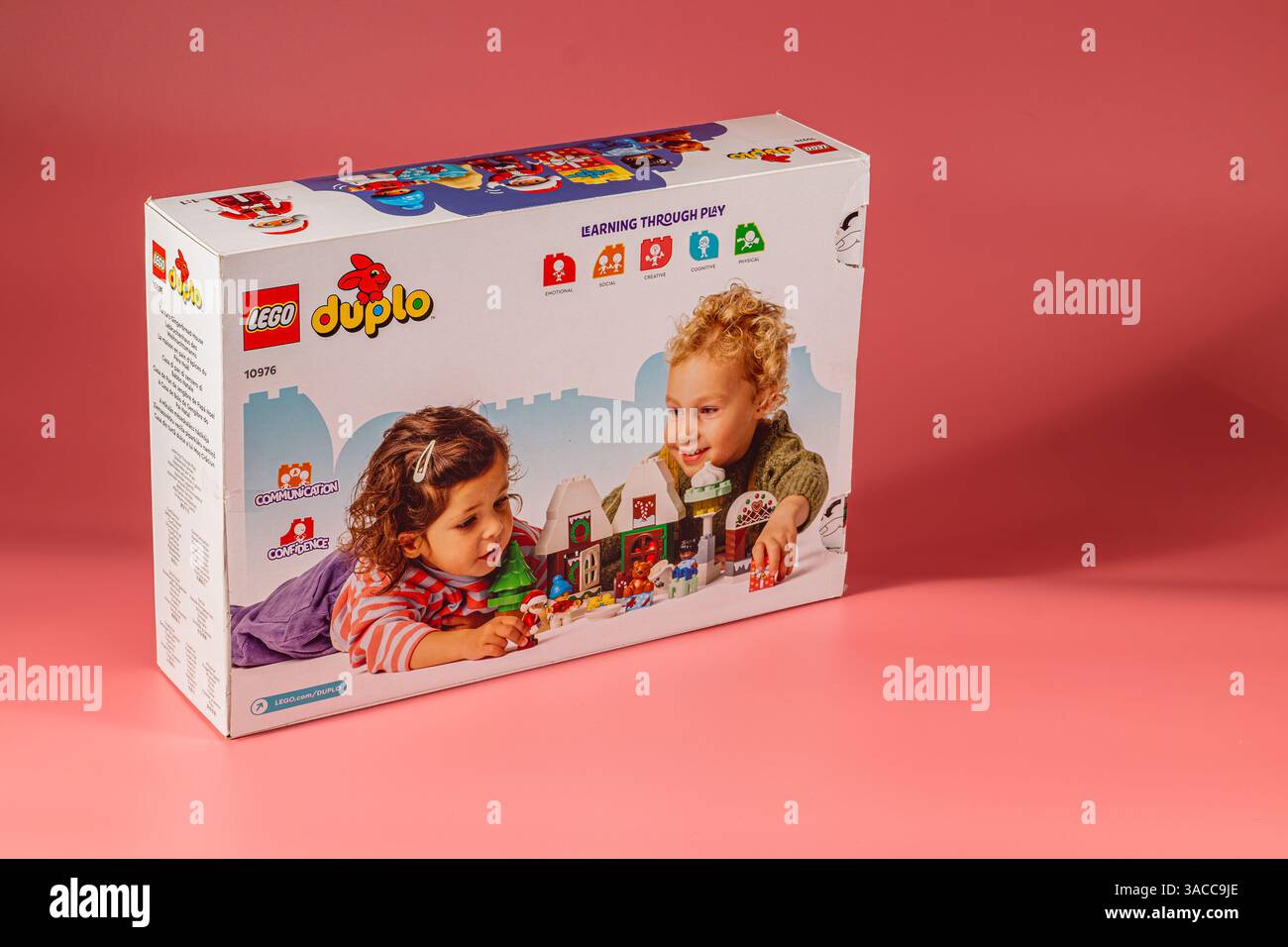 Two children engage in imaginative play with a colorful building block ...