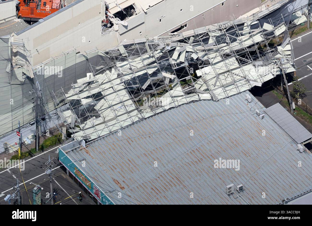 An aerial photo shows a scaffolding collapsed in Akishima City, western ...