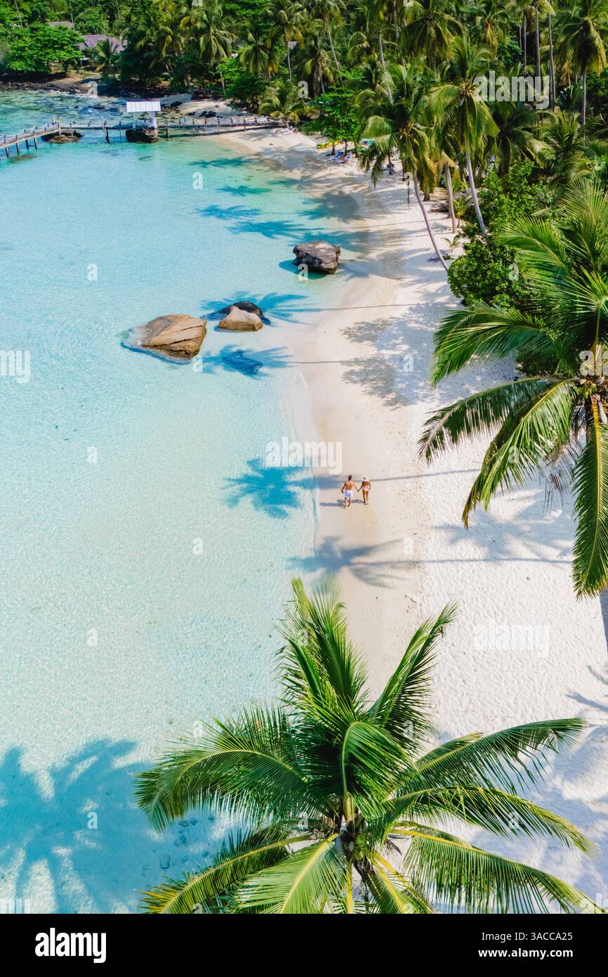 The stunning turquoise waters and pristine golden sands of Koh Kood Island, Thailand, create a ...