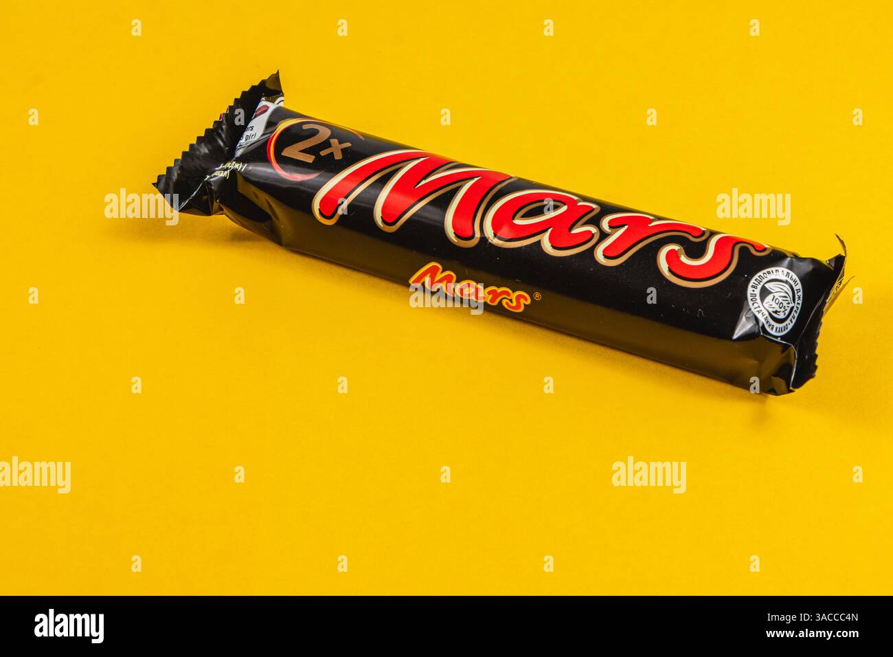 Lviv Ukraine 04.02.25 Two Mars candy bars are wrapped in black ...