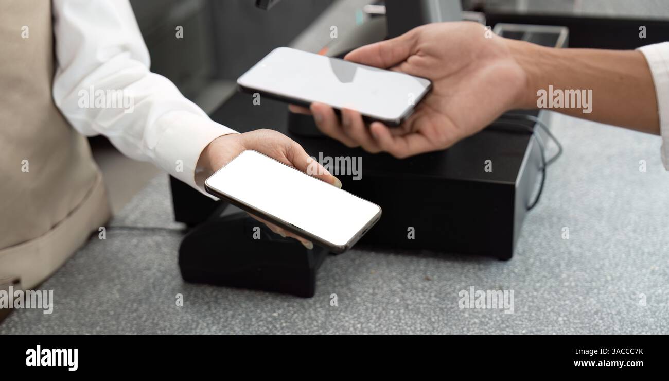 Contactless Payment and Technology. A customer using a mobile device to ...