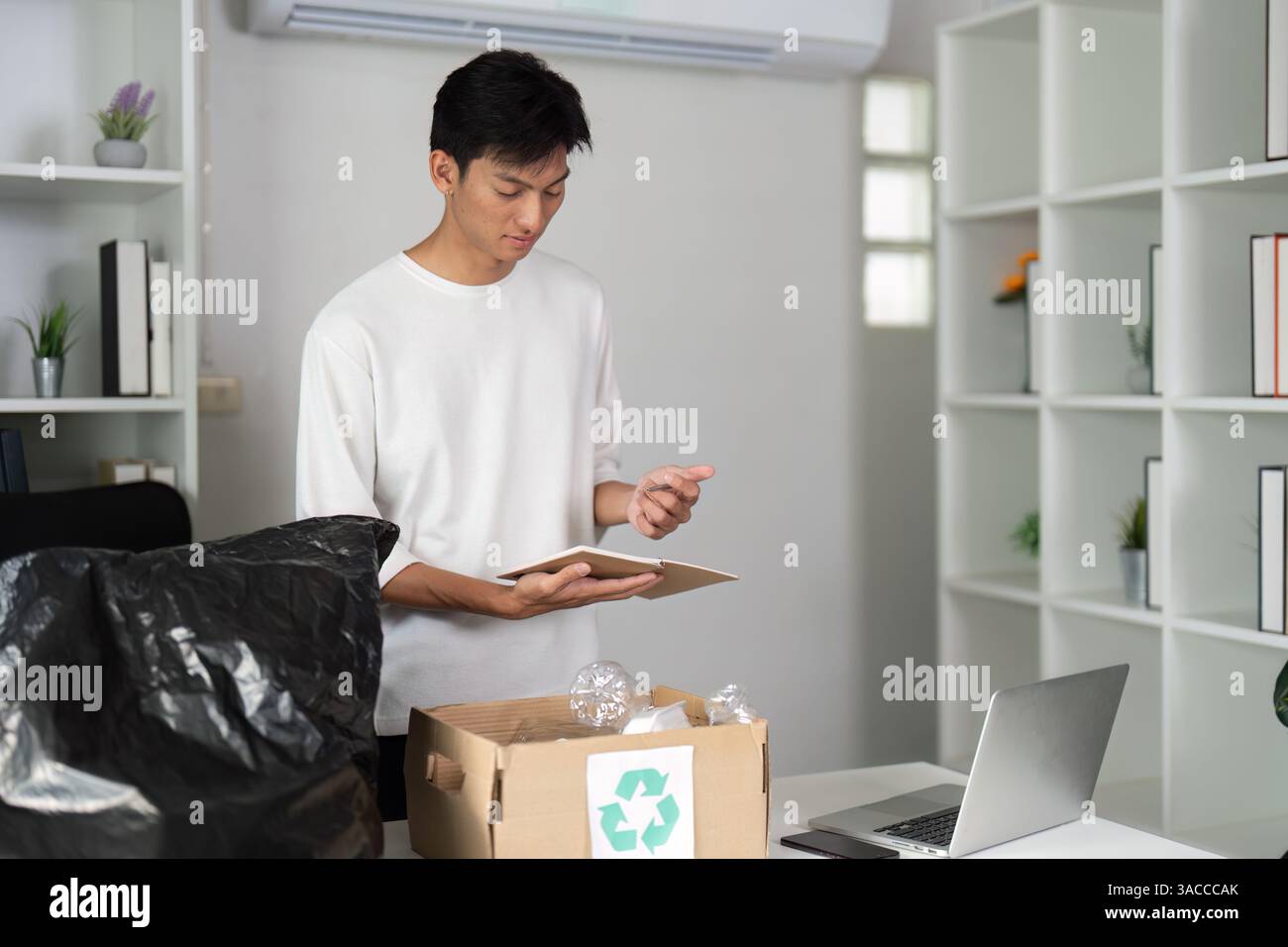 Environmental Conservation and Recycling. A person examining items for ...