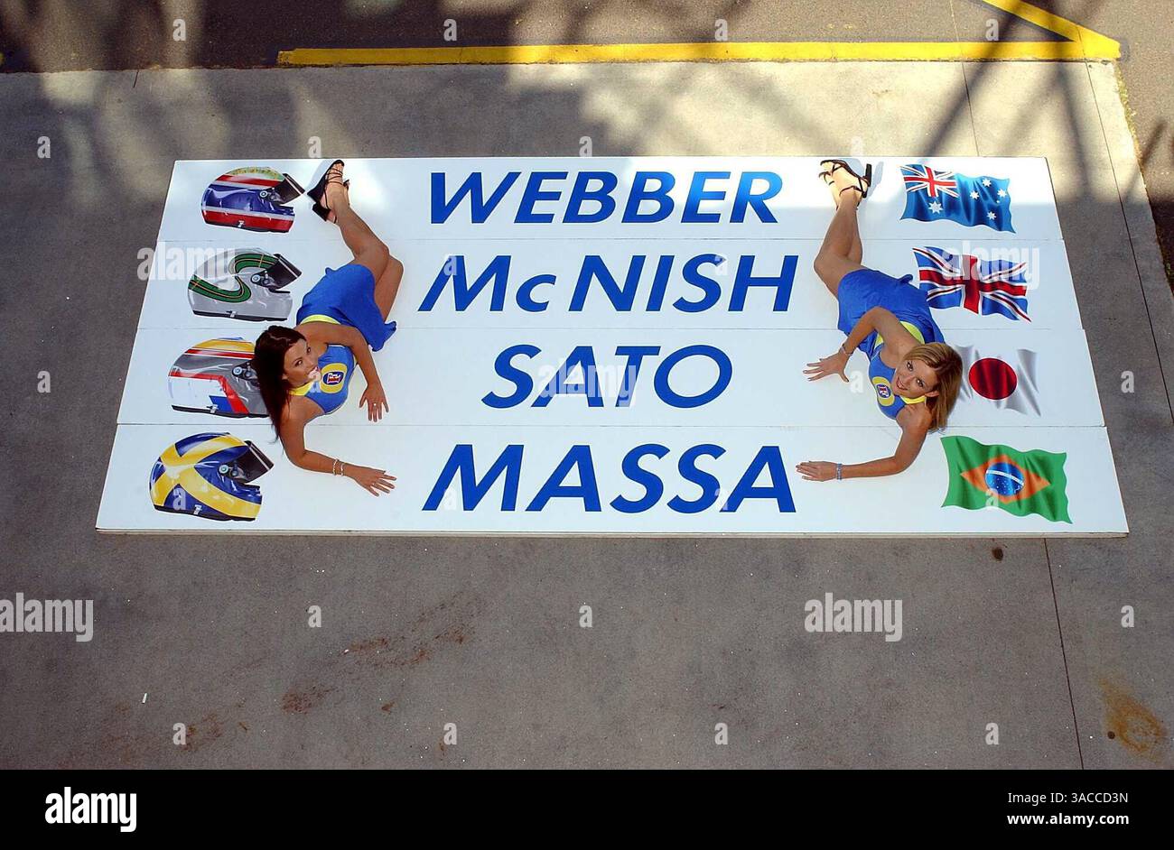 The Foster's Girls parade with the 2002 Formula One rookies pit garage ...