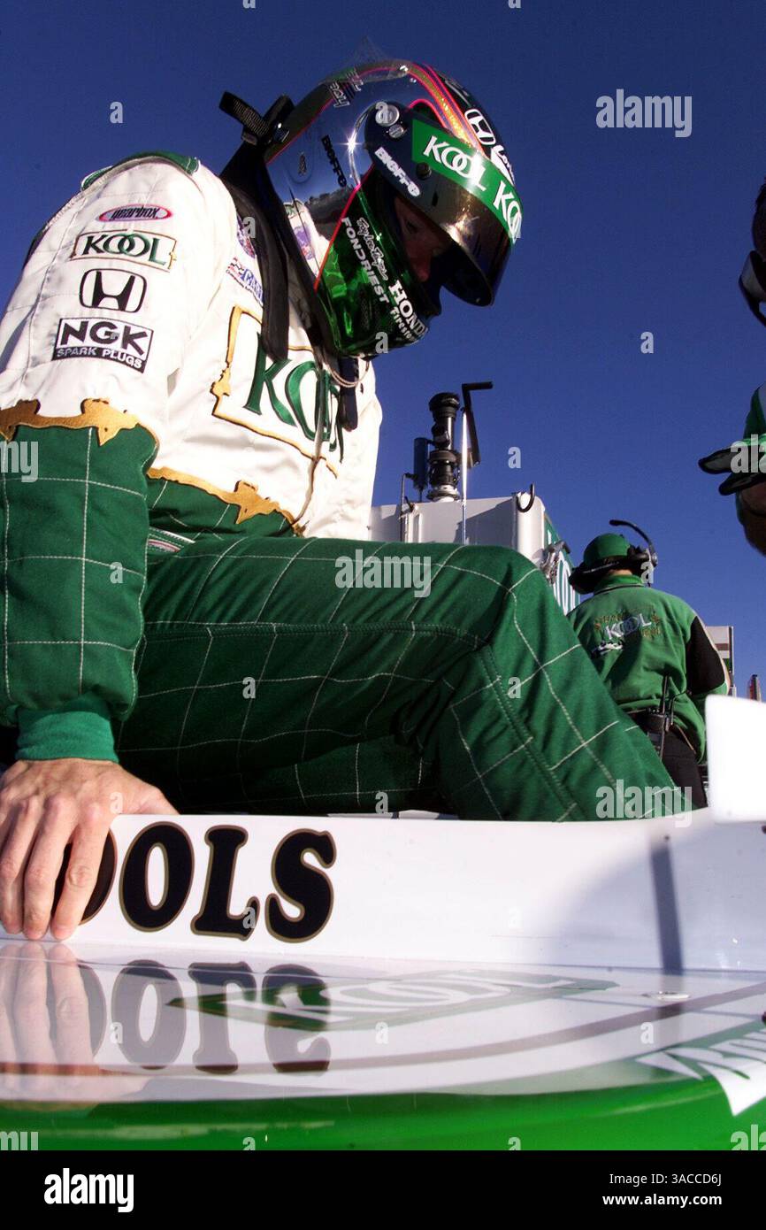Paul Tracy (CDN) Team Kool Green Racing climbs into the cockpit of his ...