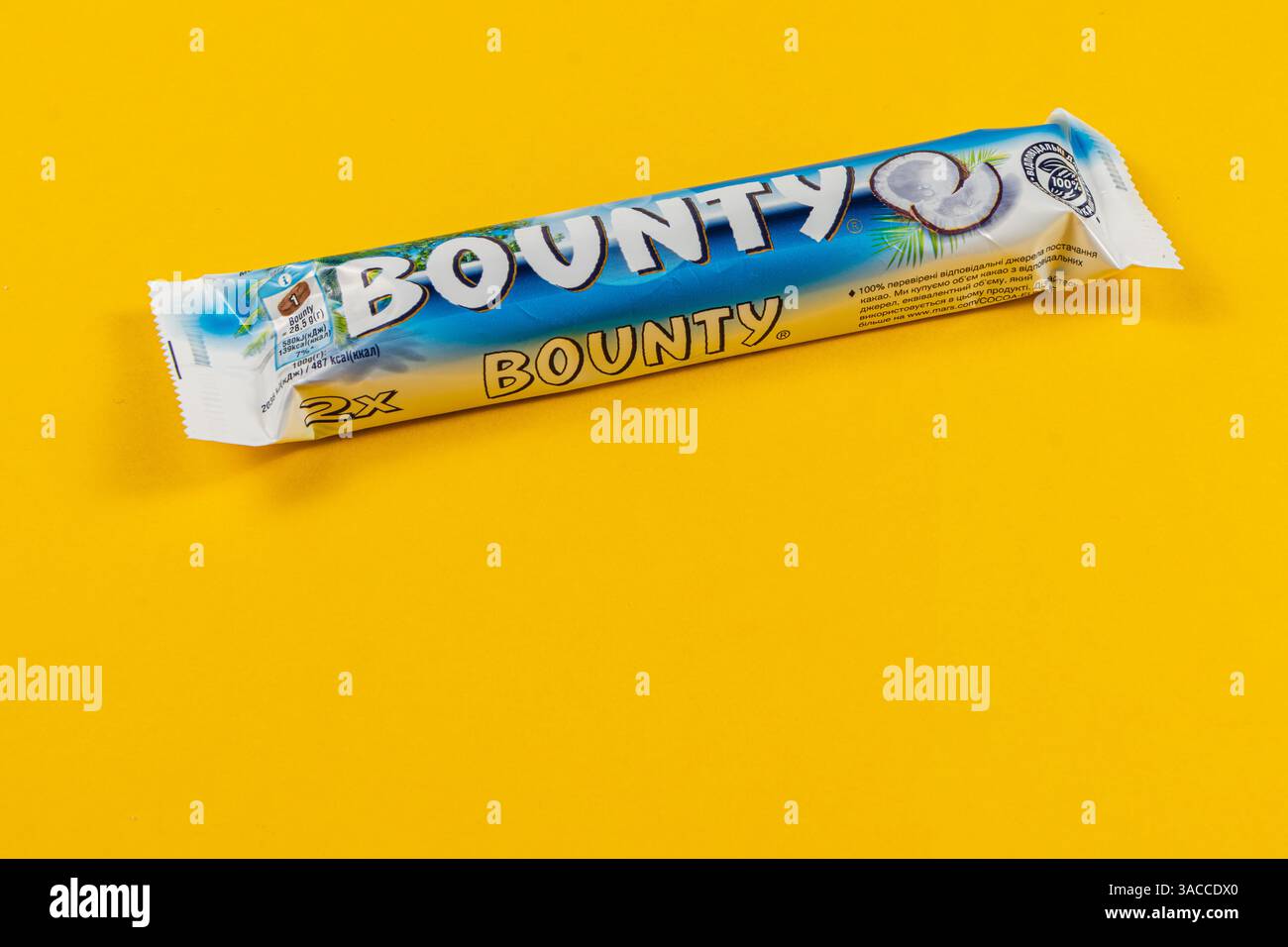 Lviv Ukraine 04.02.25 Bright yellow background complements a Bounty ...