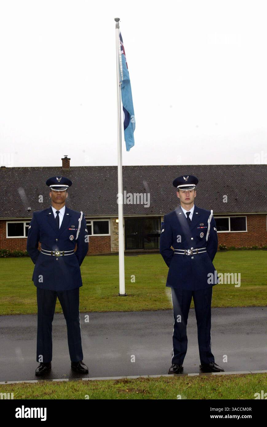 Airmen from the United States Air Force (USAF) raise the Royal Air ...