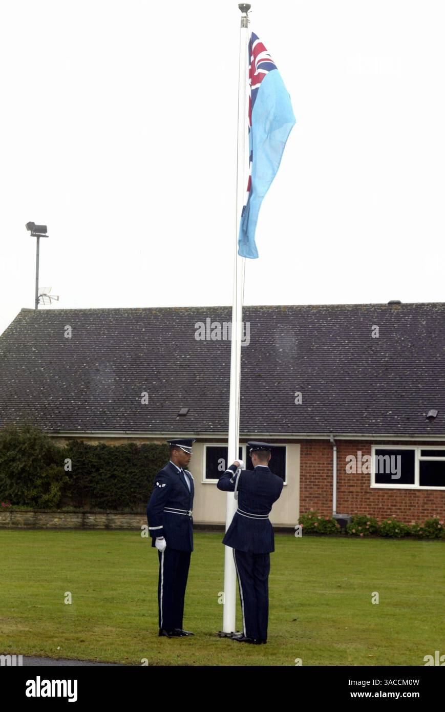 Airmen from the United States Air Force (USAF) raise the Royal Air ...
