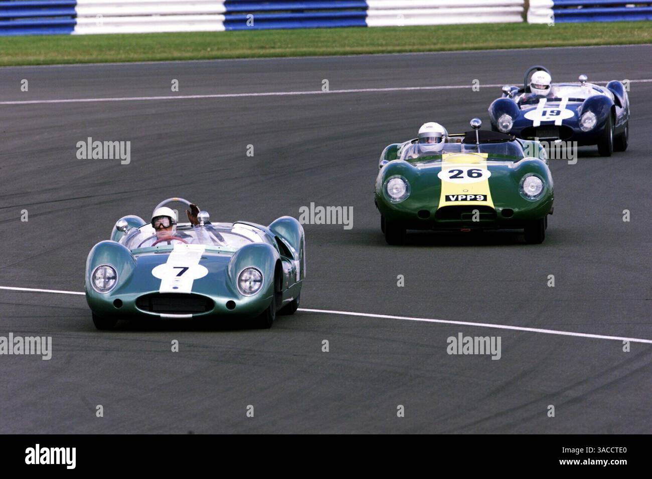 Sir Stirling Moss (GBR) Lola Mk1, is chased by Don Thallon (AUS) Lister ...