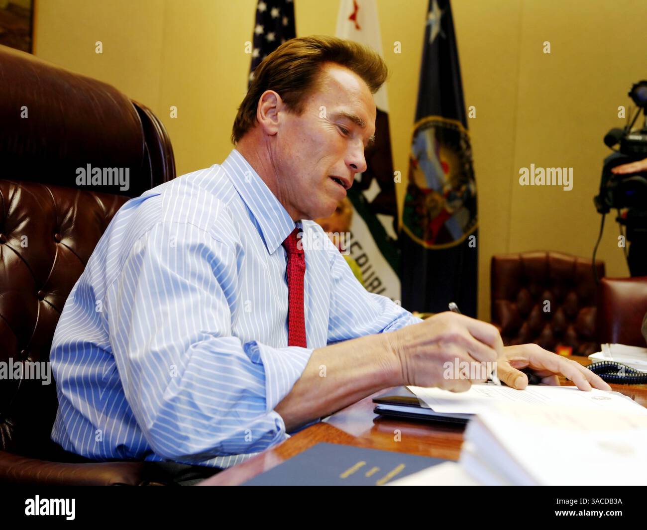 Governor Arnold Schwarzenegger signs new bills into law in the Ronald ...