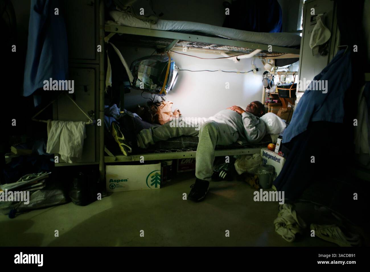 JUMP LEDE Vaughn Bradford, sits in his bead watching television that ...