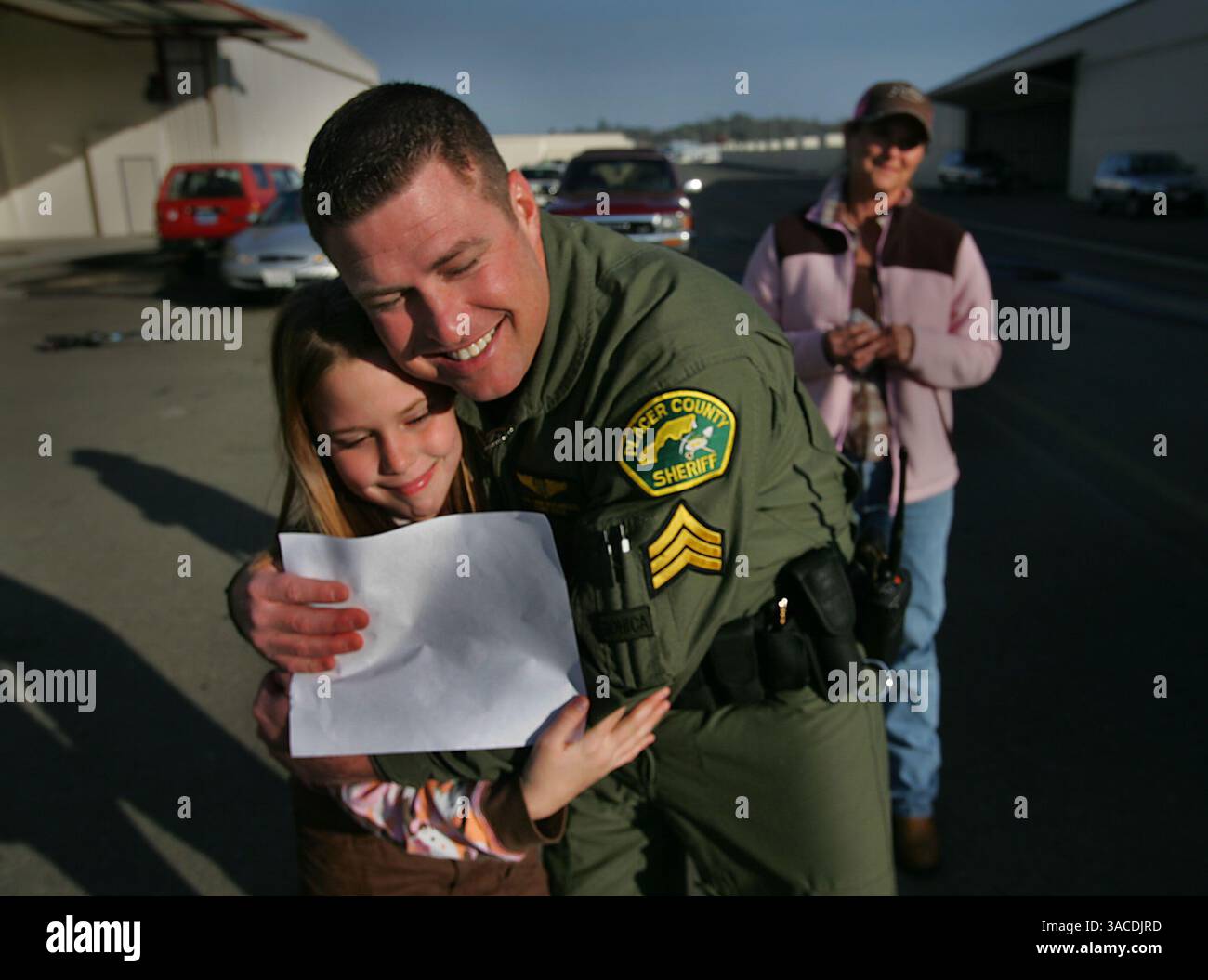Dakota Wilson 8, gets a hug from Placer county sheriffs officer Van ...