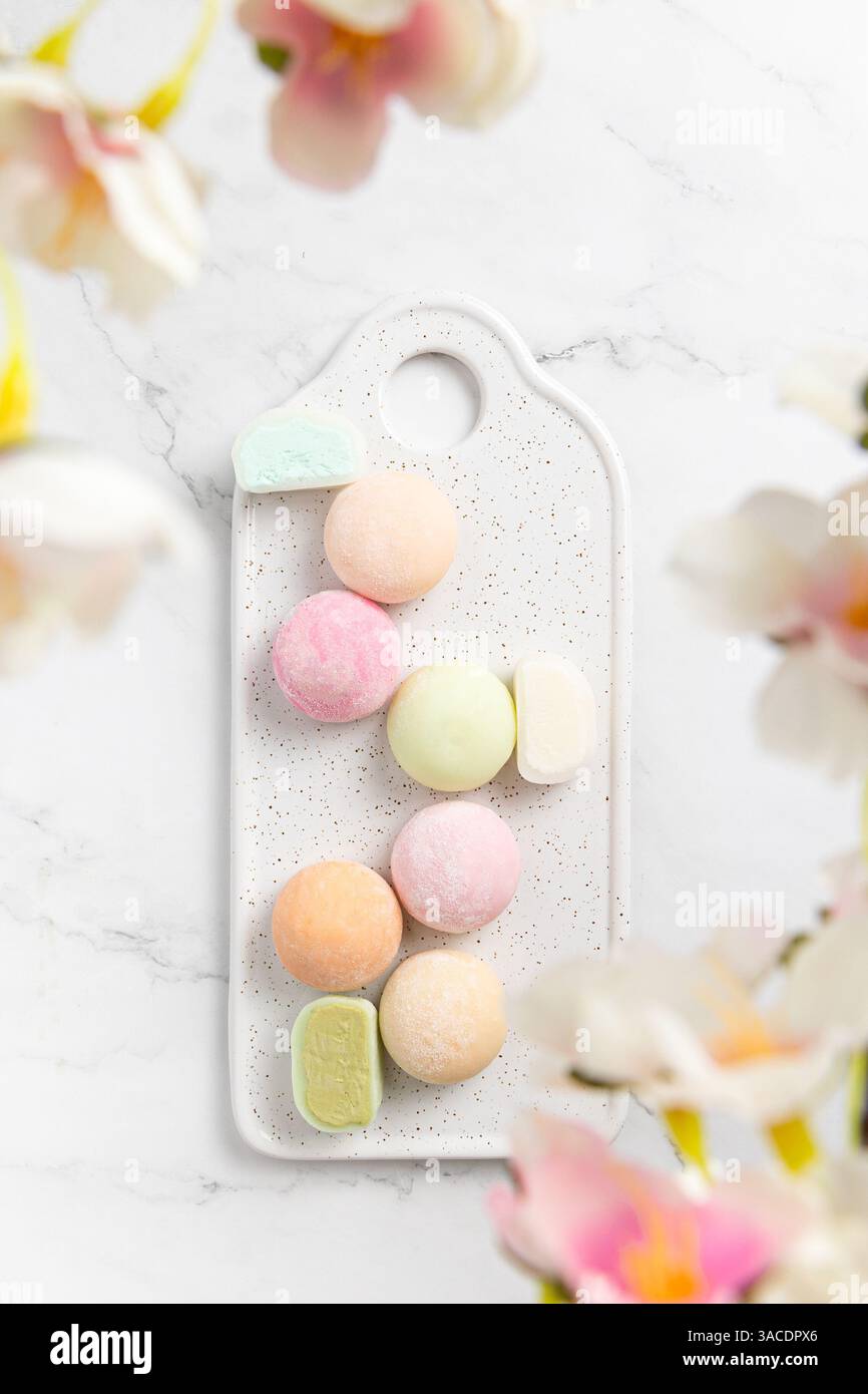 colorful frozen mochi with vibrant color background Stock Photo - Alamy