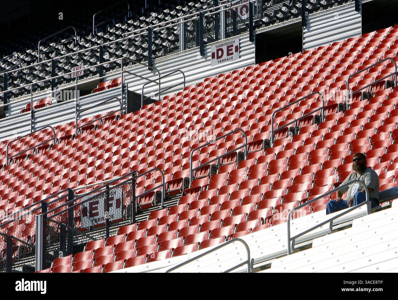 A fan sits in the stands and watches the first COT Cup practice at ...