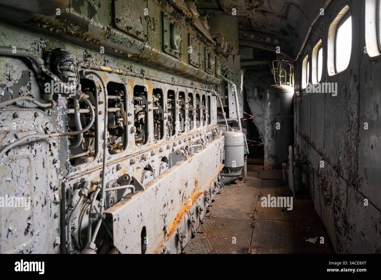 An engine room of an old russian soviet era diesel train with peeling ...