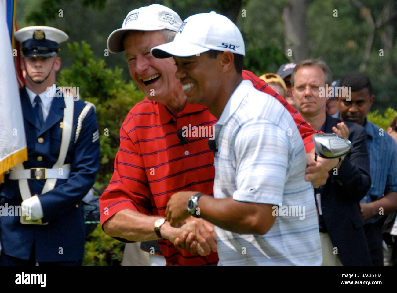 President George H.W. Bush and Tiger Woods laugh together after Bush at ...