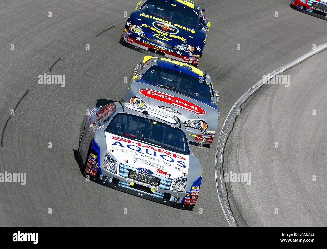 Carl Edwards leads Kyle Busch early in the USG Durock 300 Busch race at ...