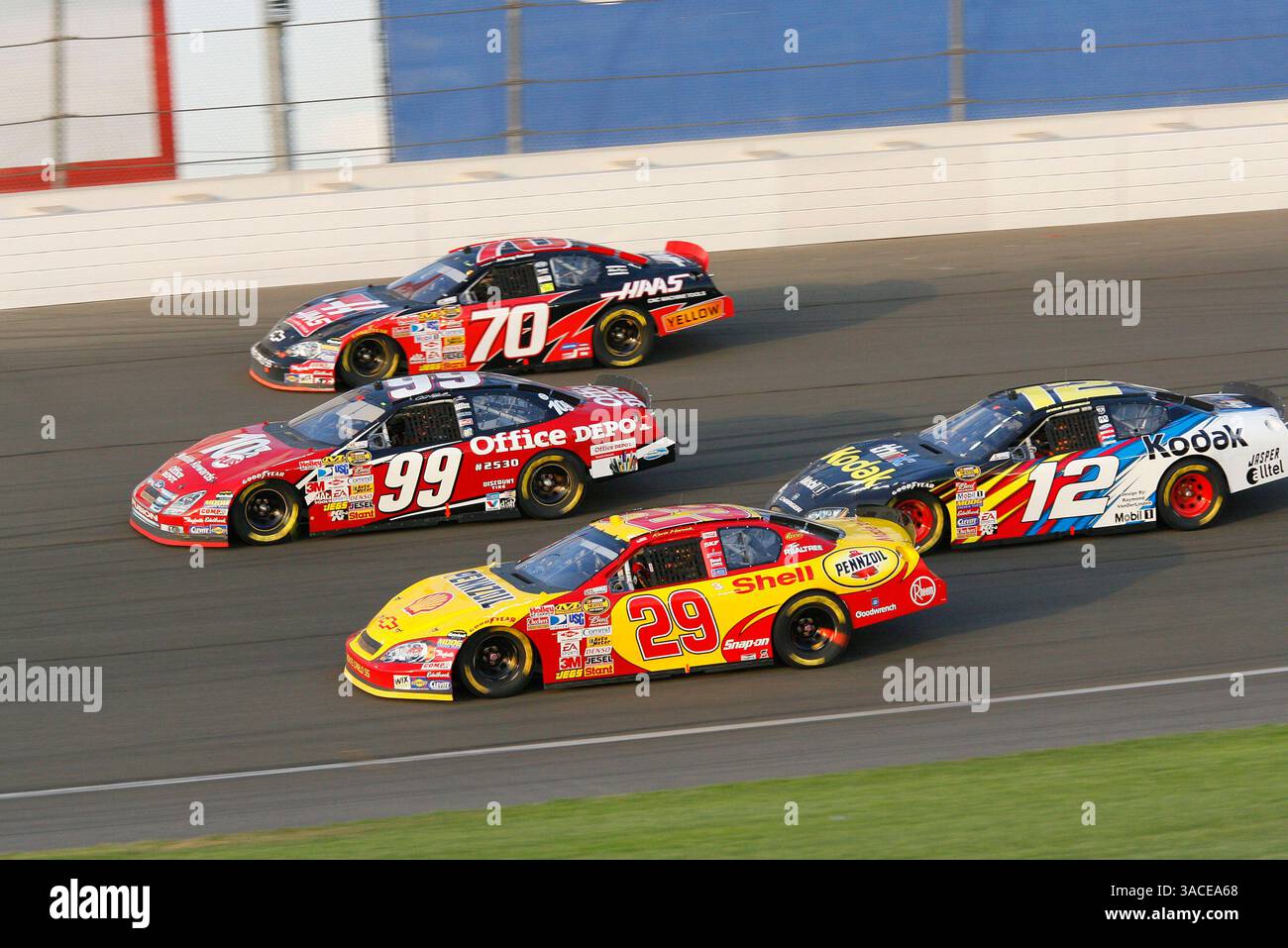 Kevin Harvick leads Carl Edwards, Johnny Sauter, and Ryan Newman in ...