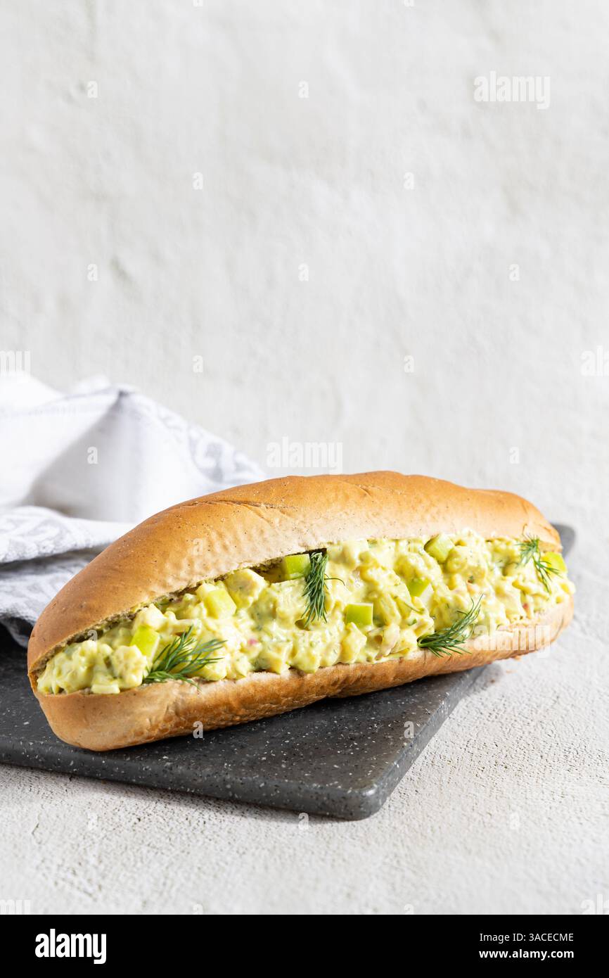 Healthy sandwich filled with fresh ingredient on simple minimal gray ...