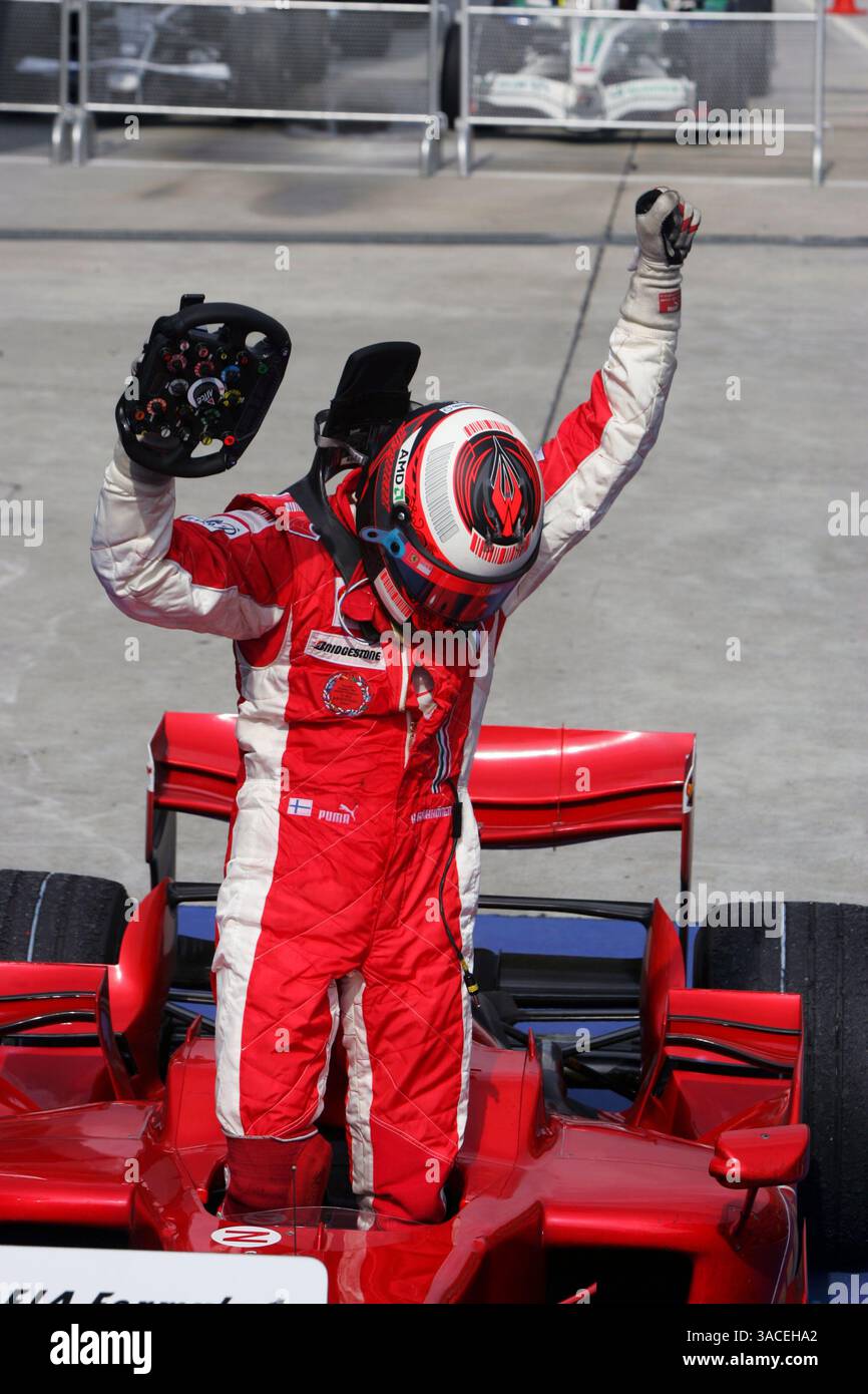 Race winner Kimi Raikkonen (FIN) Ferrari F2008 celebrates in parc ferme ...