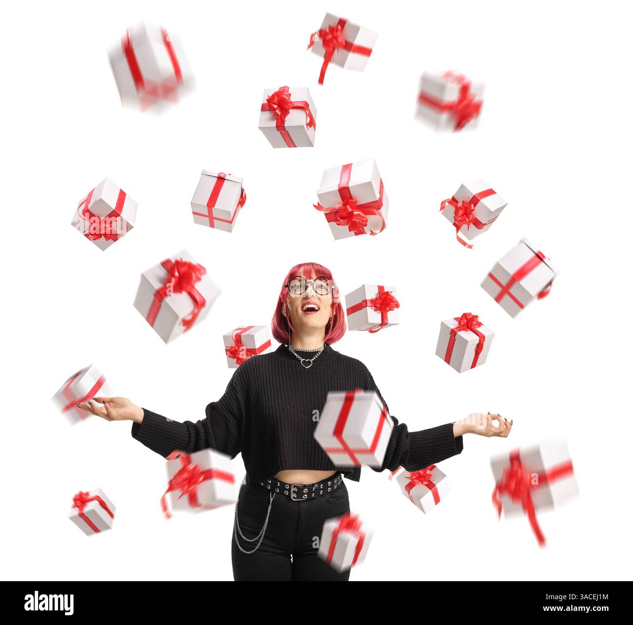 Young woman spreading her arms and looking at falling presents isolated ...