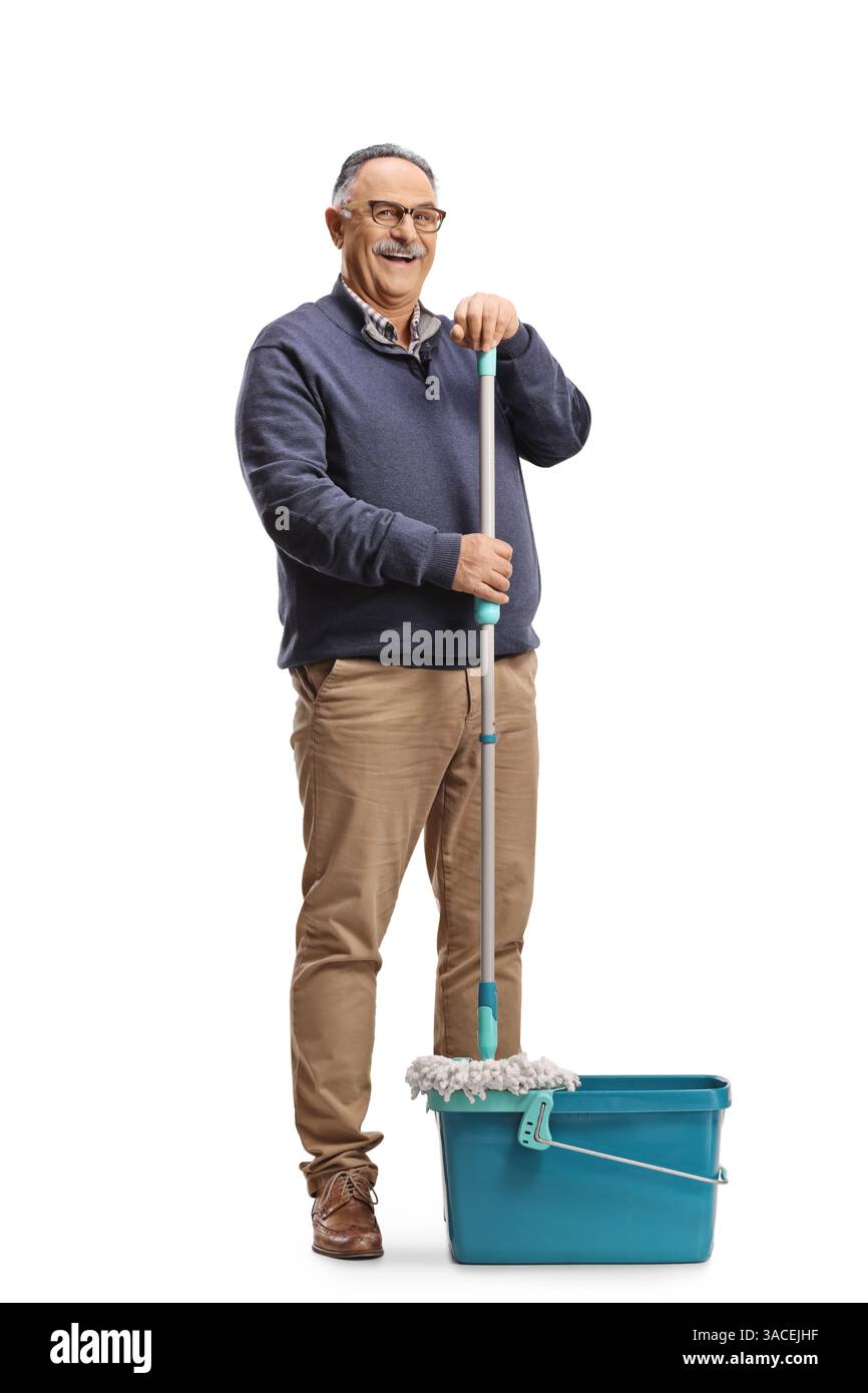 Smiling mature man with a mop and bucket isolated on white background ...