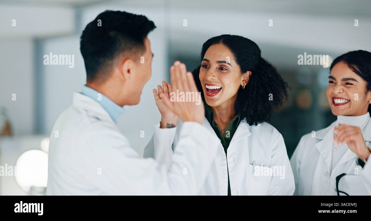 High five, happy and scientists in laboratory with medical project ...
