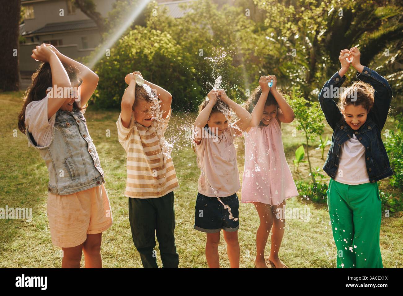 Children group splashing kids splash hi-res stock photography and ...