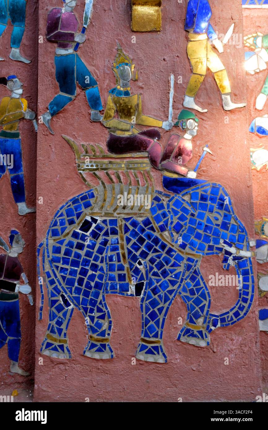 Laos: Elephants and mahouts in a coloured glass mosaic at Wat Xieng ...