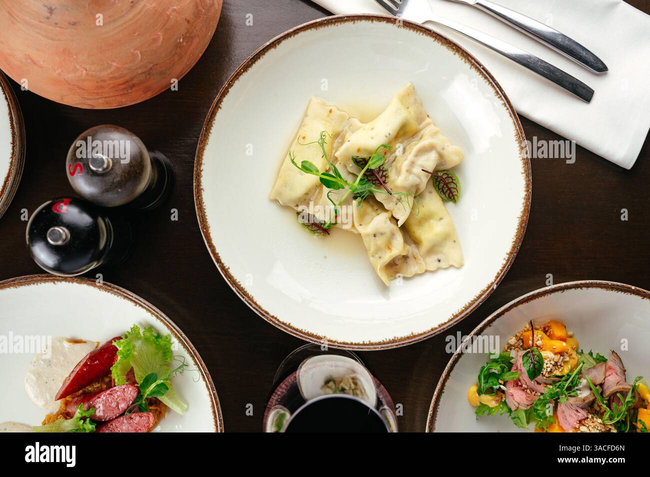 ravioli with herbs and sauce in a restaurant Stock Photo - Alamy