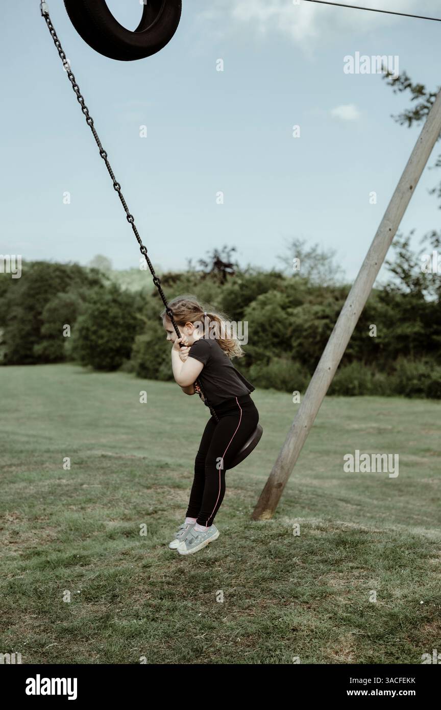 Girl is playing at cableway at playground. ridding at ropeway Stock ...